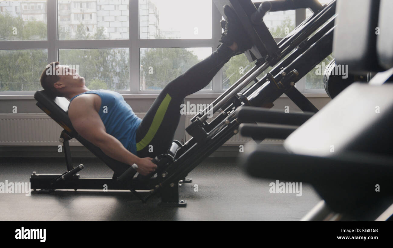 Man exercising on leg press hi-res stock photography and images - Alamy