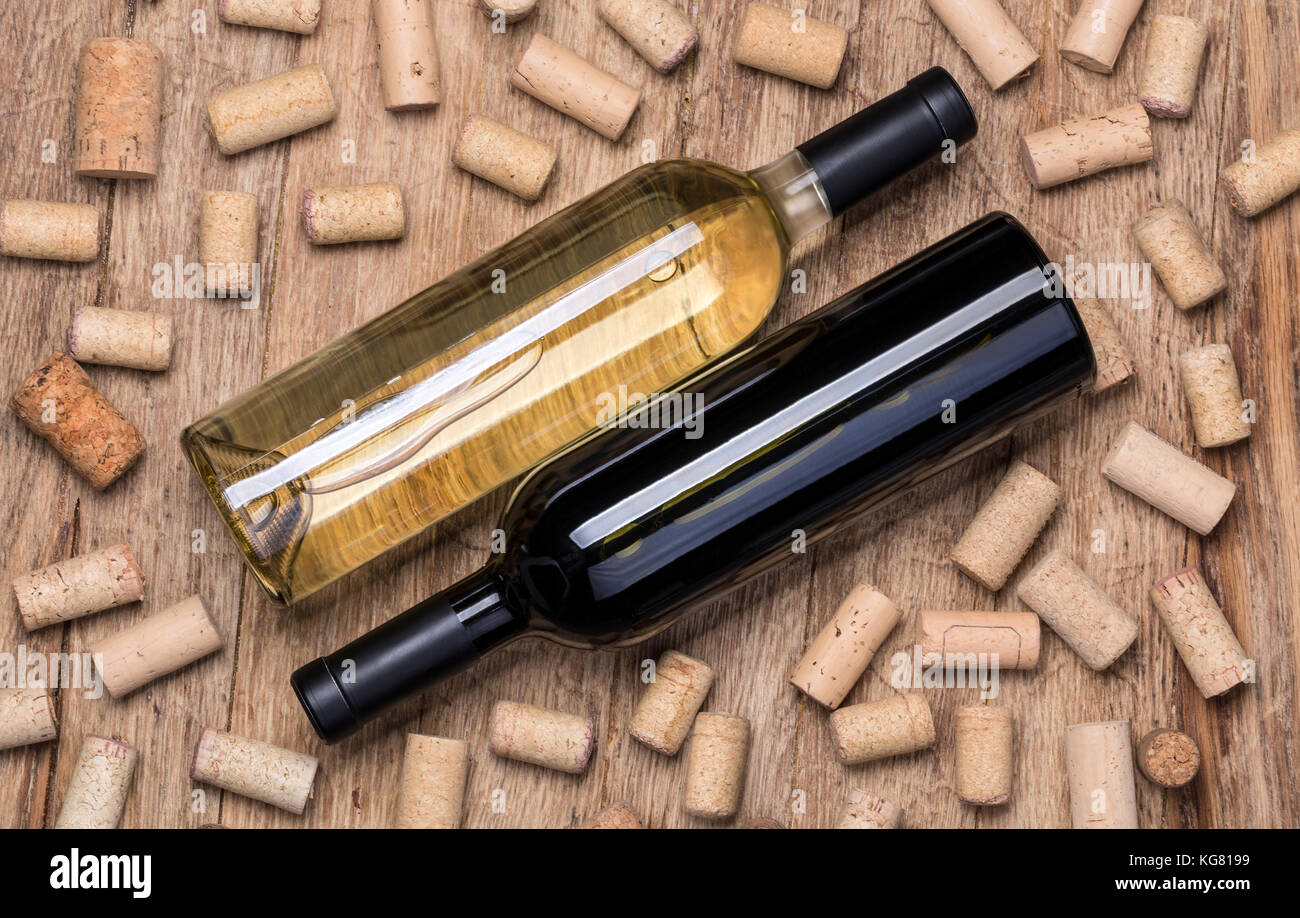 Two wine bottle and corks background Stock Photo - Alamy