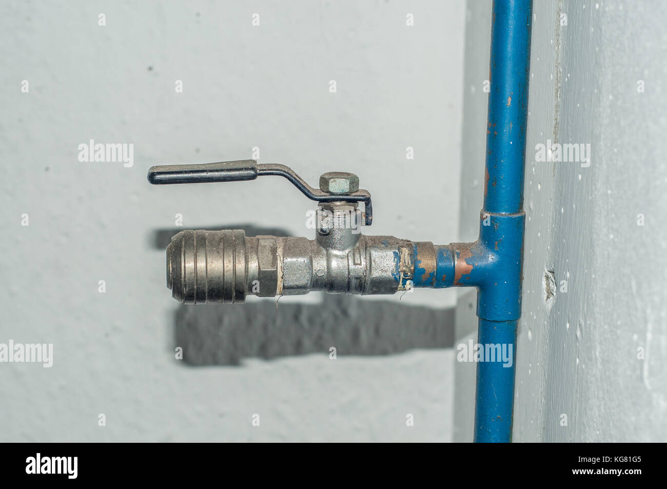 water metal pipe with tap on a white wall Stock Photo - Alamy