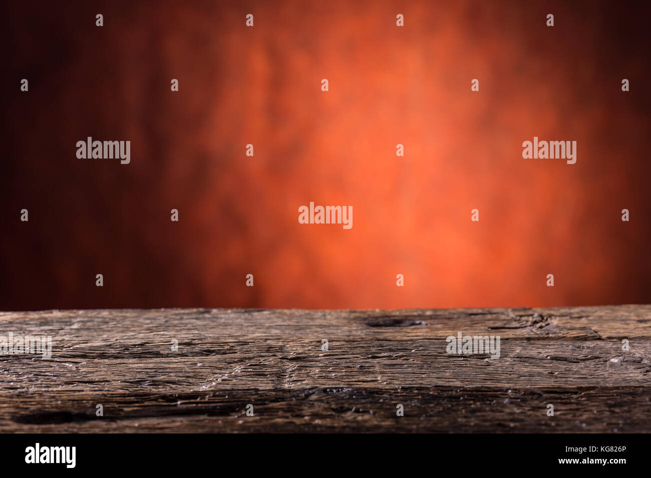 Empty wooden oak table and abstract red orange background.Free space ...