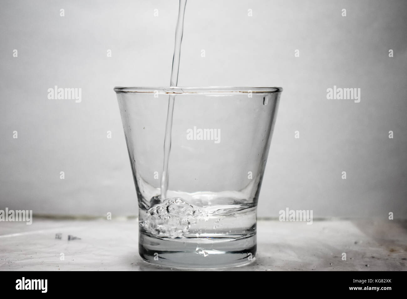 filling water in glass Stock Photo - Alamy