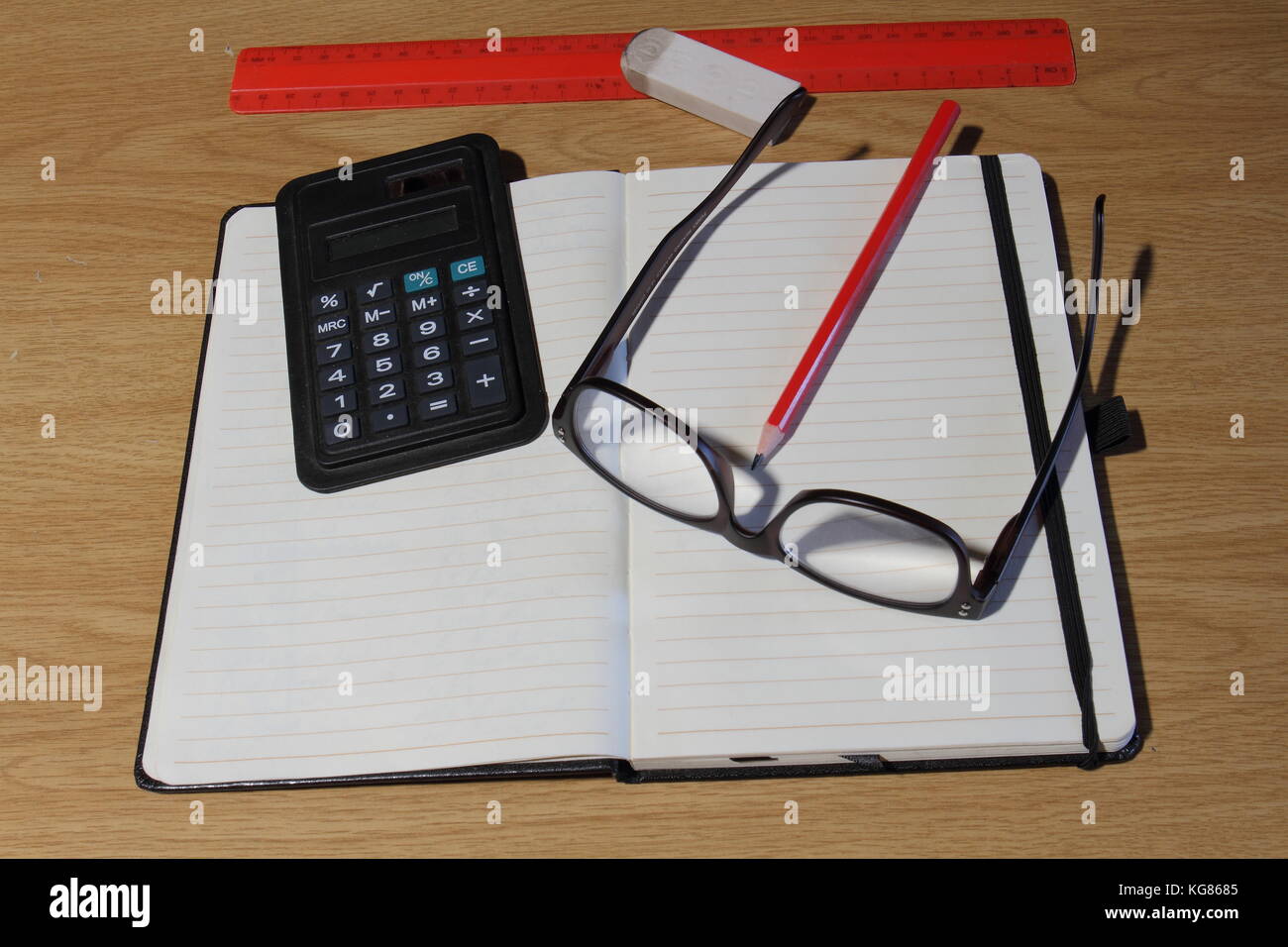 View from above of a desk with study materials and aids in landscape ...