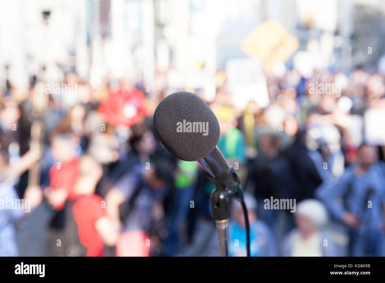 Microphone in focus against blurred crowd Stock Photo - Alamy