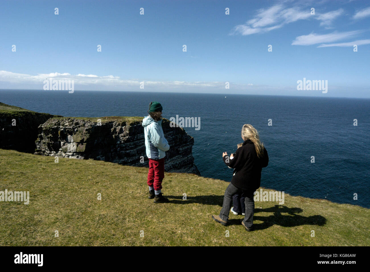 Visitors admiring the clear Atlantic ocean from Great Stack on the ...