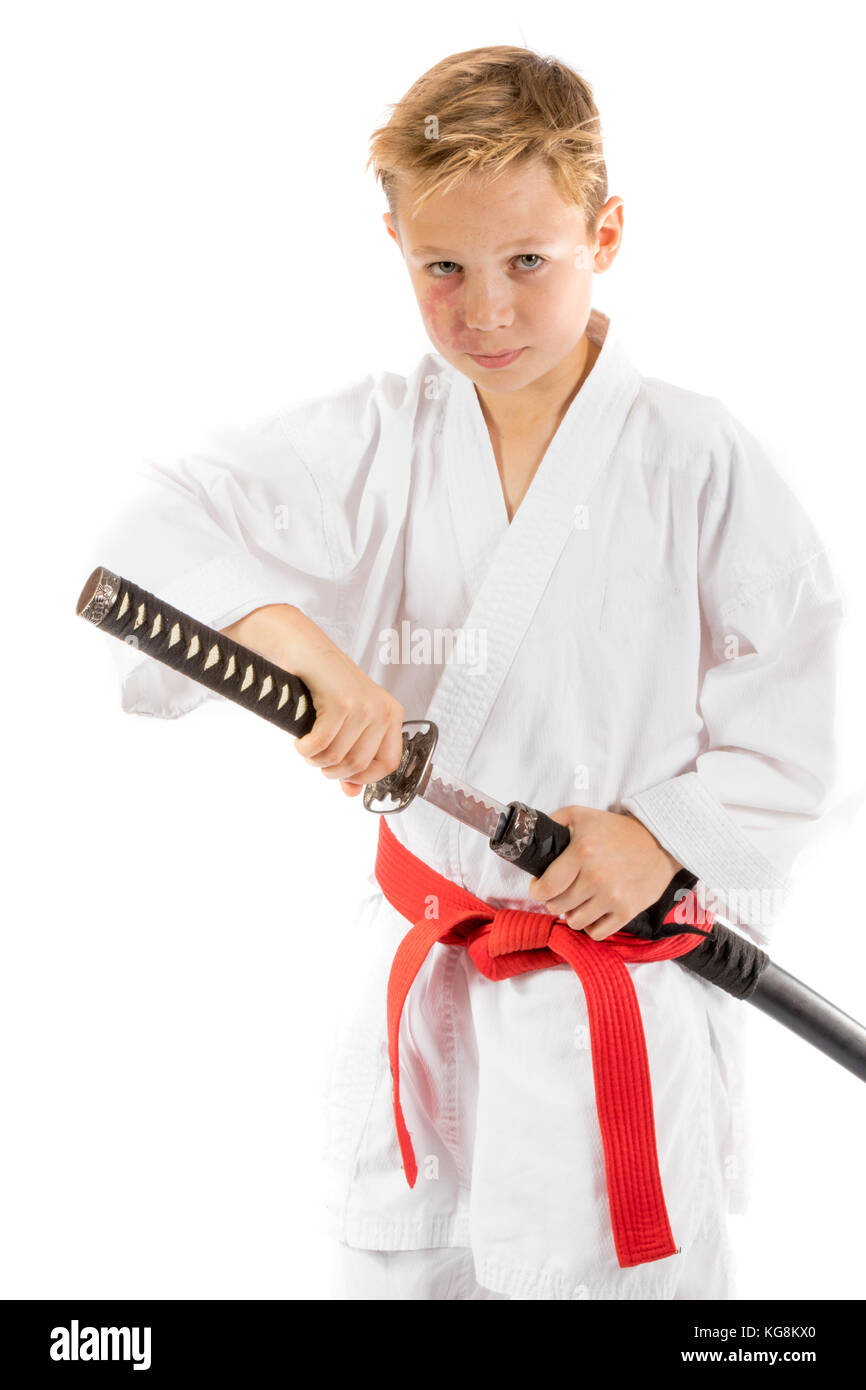 Pre-teen boy with a samurai sword isolated on a white background Stock ...