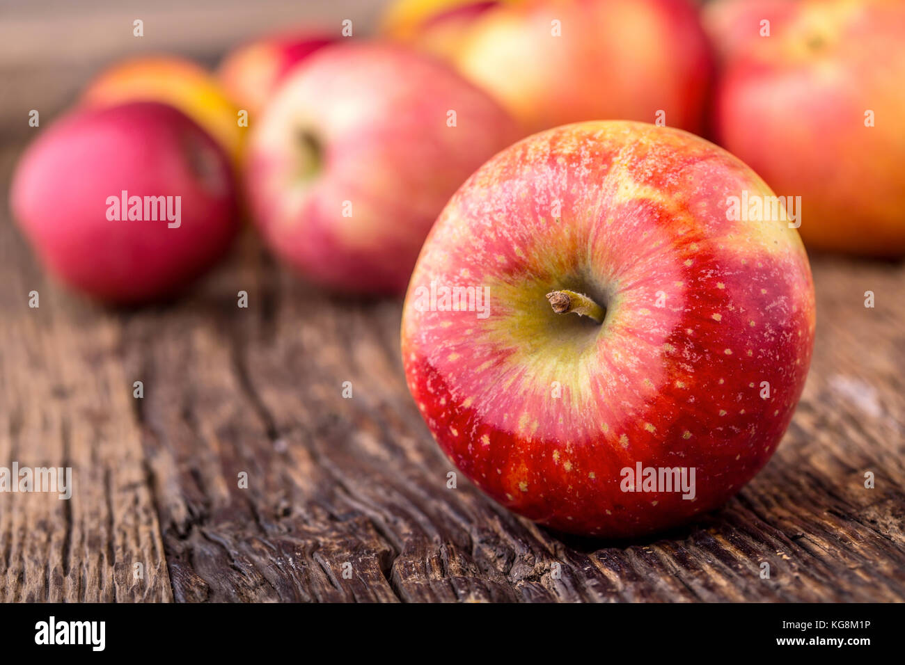 Apple. Red Apples in other positions on wooden board Stock Photo - Alamy