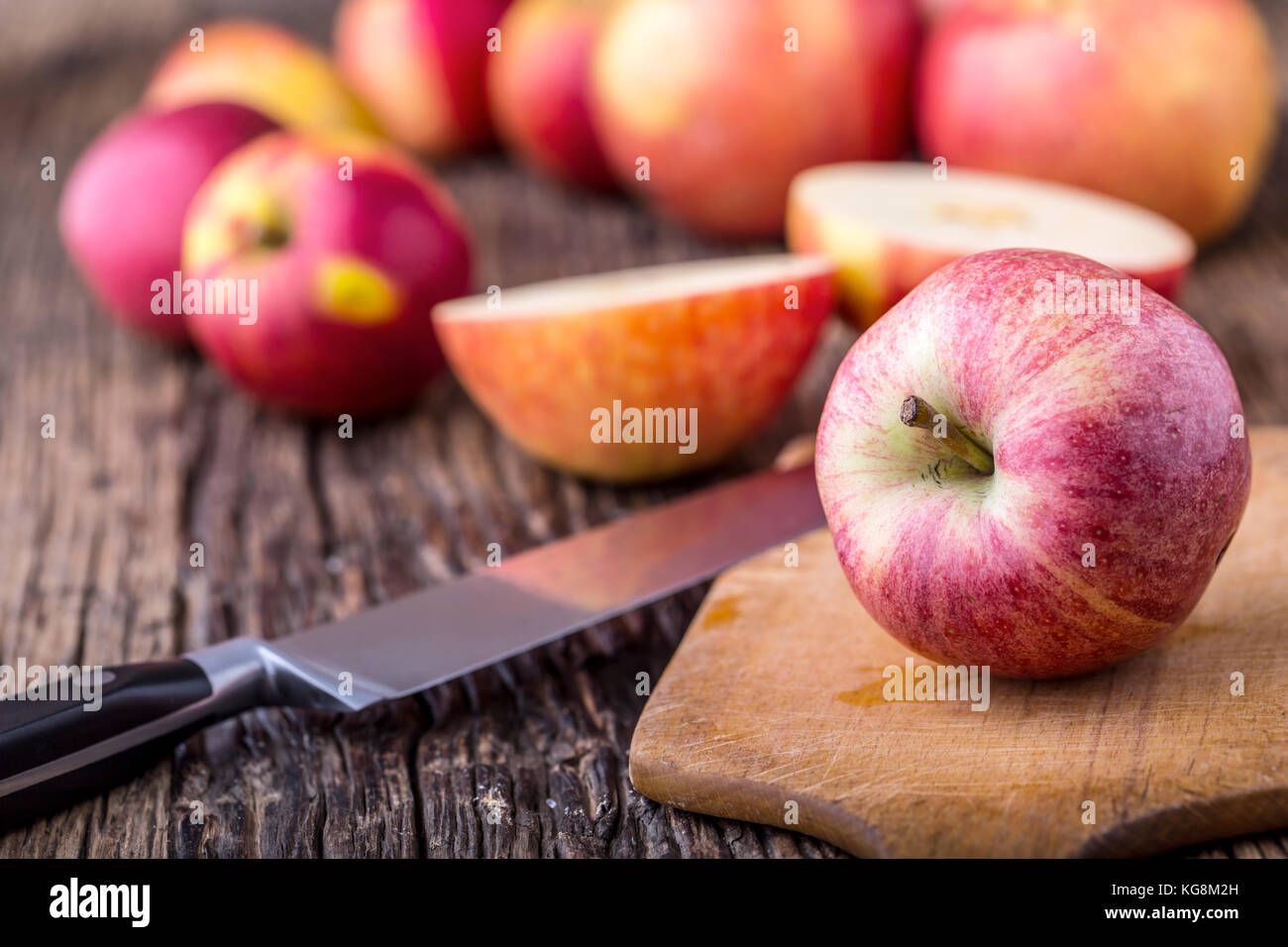 Apple. Red Apples in other positions on wooden board Stock Photo - Alamy