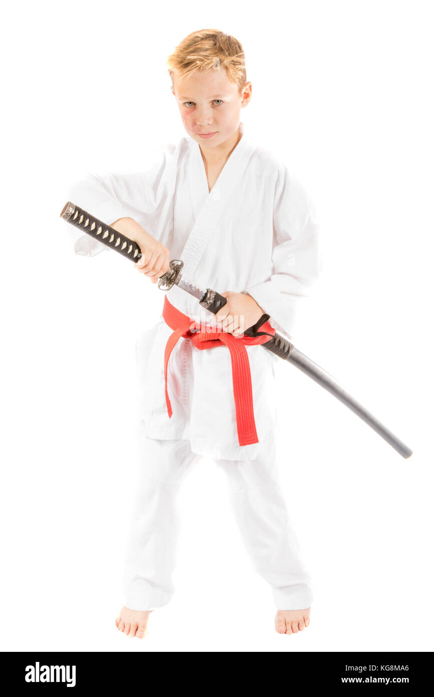 Pre-teen boy with a samurai sword isolated on a white background Stock ...