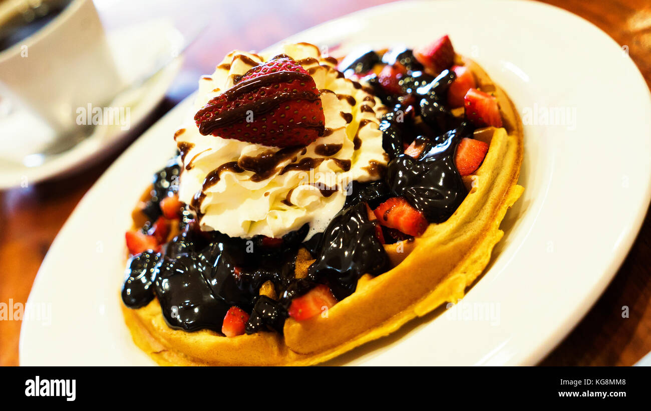 Delicious homemade waffle dessert with strawberries, blueberries ...