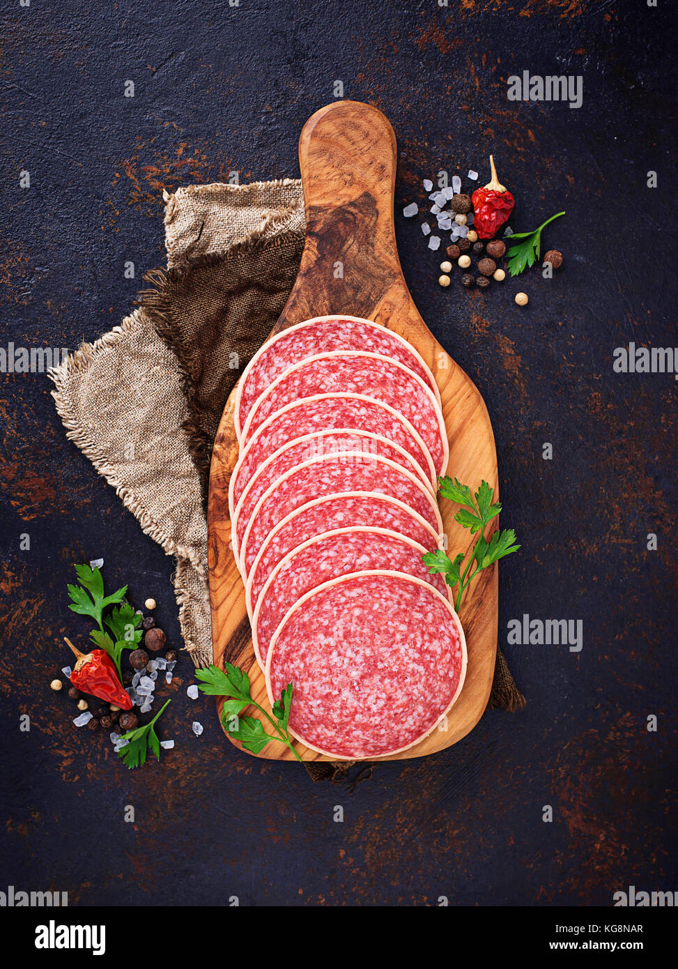 Italian salami sausage on wooden board Stock Photo - Alamy