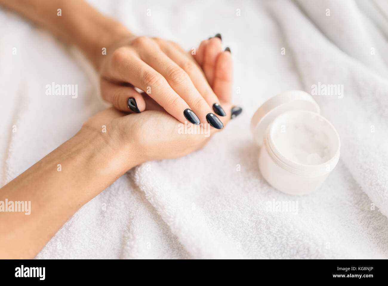 Female person hands with cream closeup, skincare. Bodycare and hygiene ...