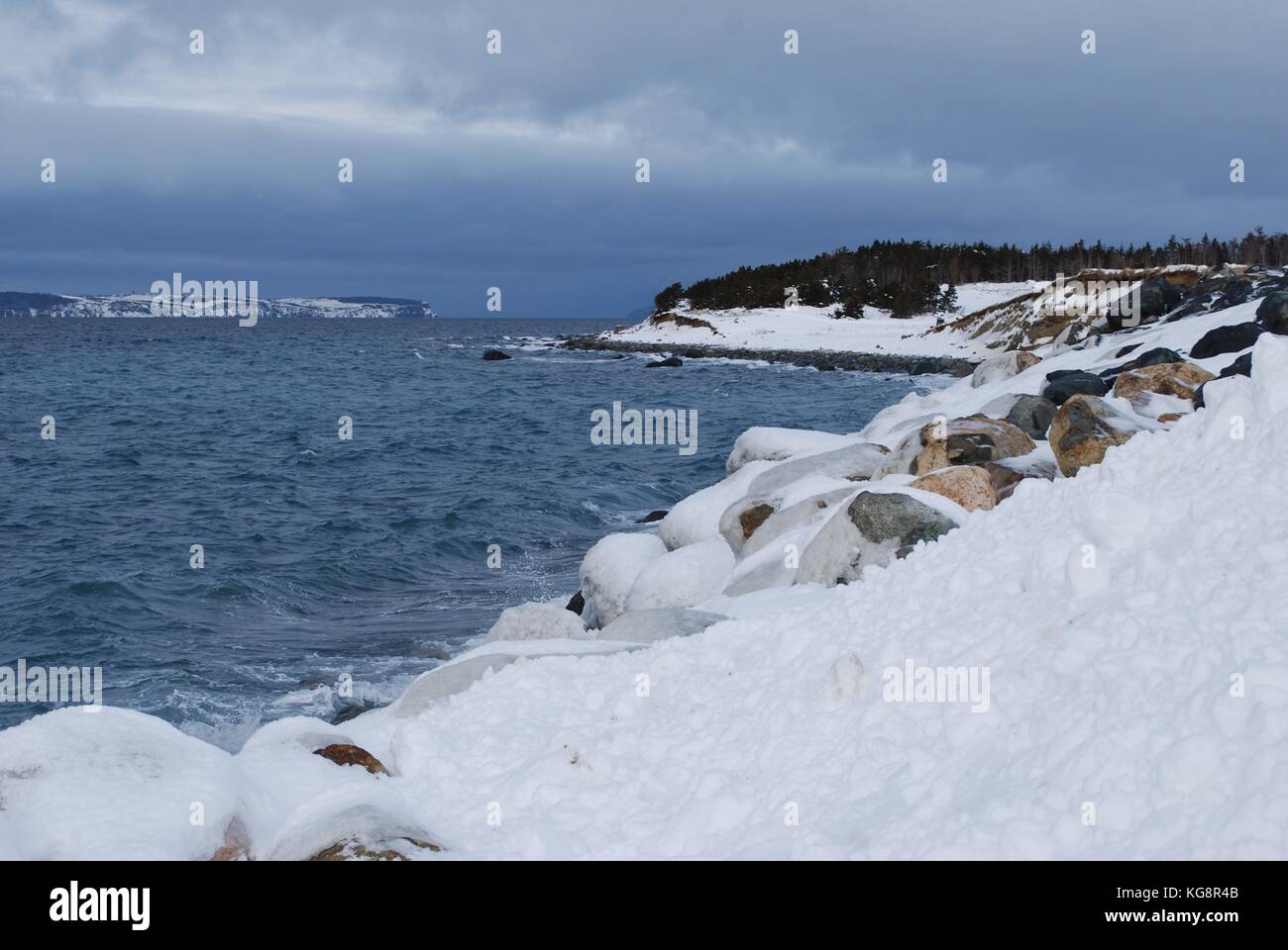 Snow and Ice covered coastline, looking across the bay to Bell Island ...