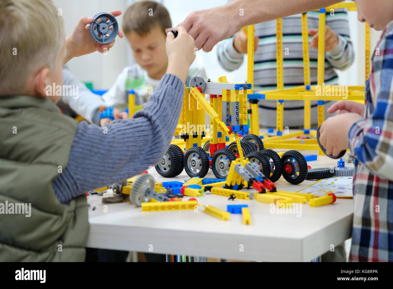 Child plays with a builder kit Stock Photo - Alamy
