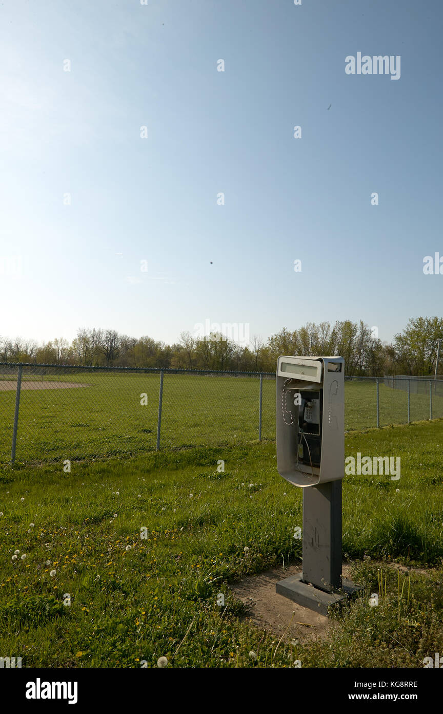 Freestanding outdoor public phone booth in a rural field or pasture for ...