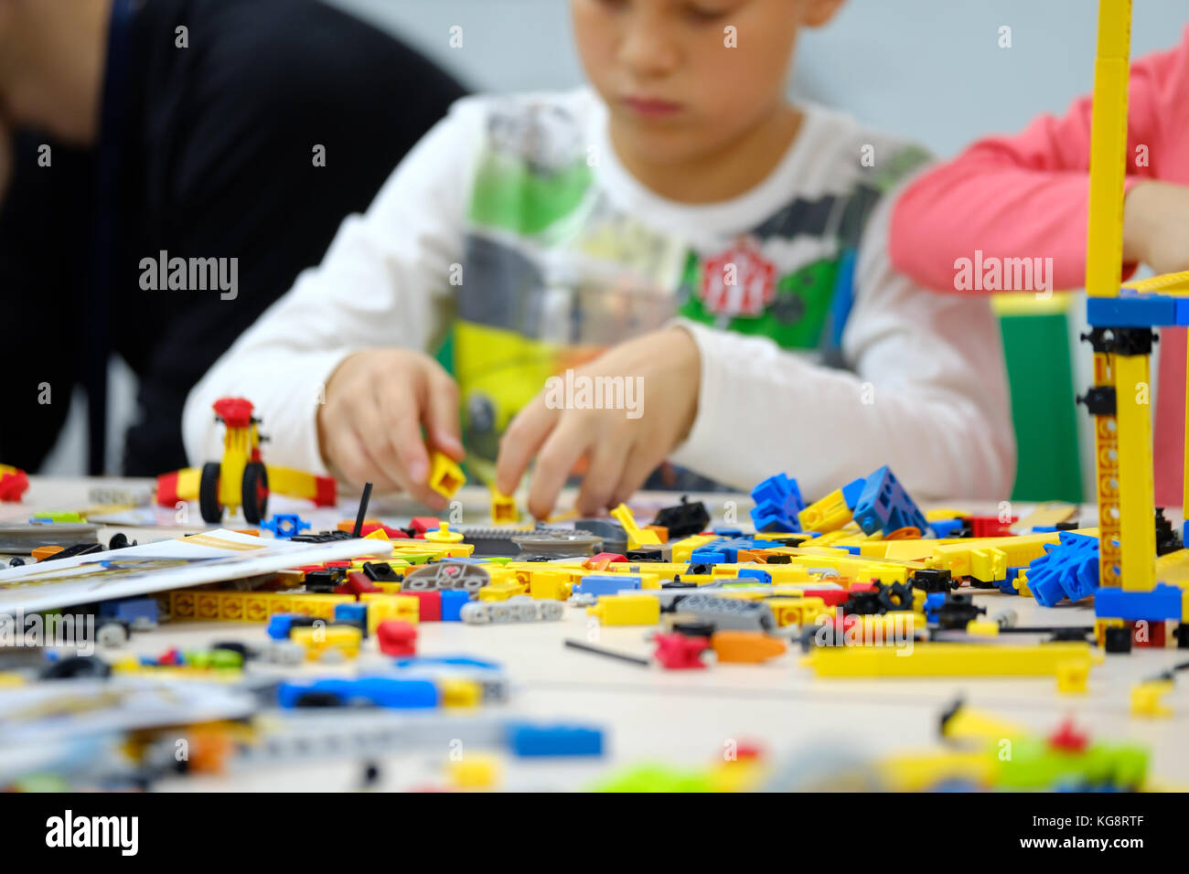 Child plays with a builder kit Stock Photo - Alamy