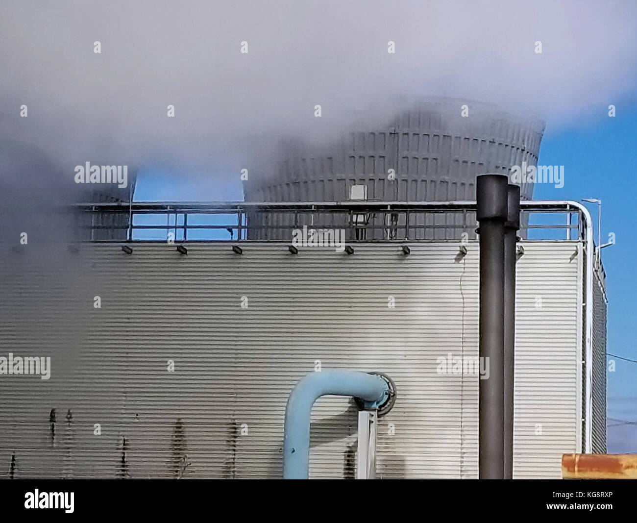steam rising out of factory cooling tower Stock Photo - Alamy