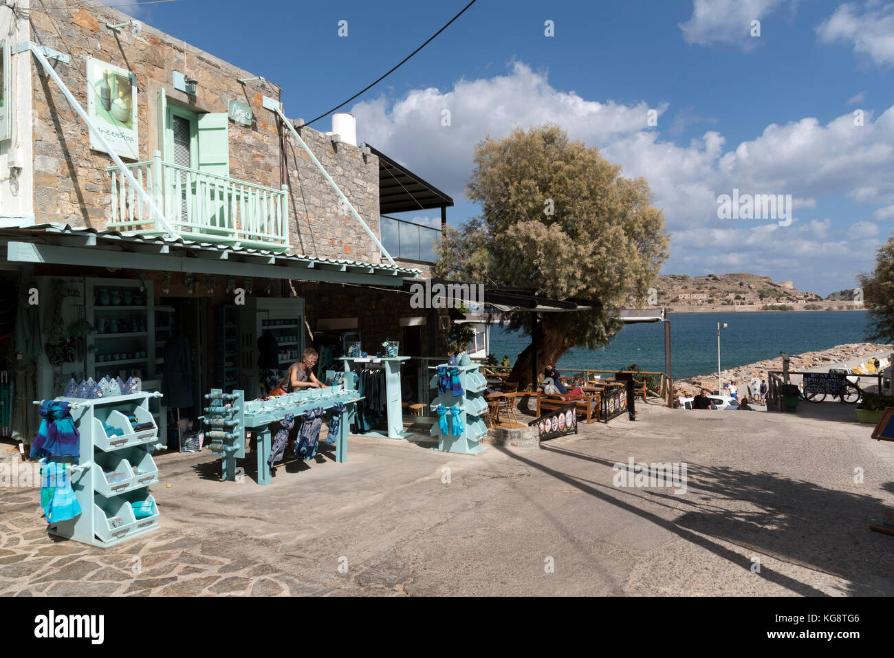 Souvenir shop in the seaside resort of Plaka with a view to Spinalonga ...