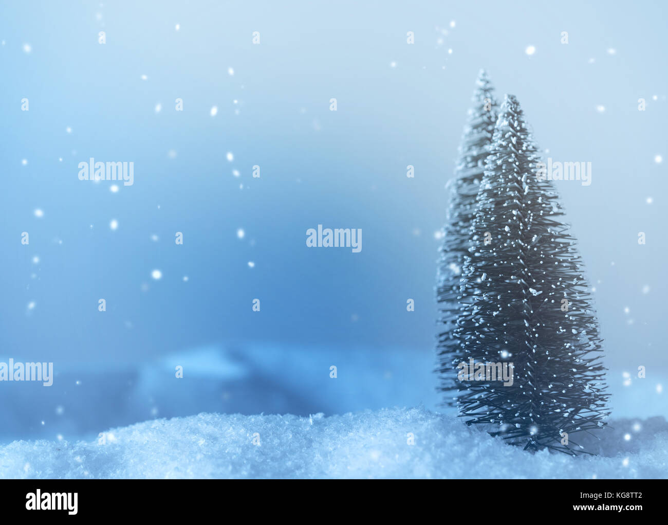 Winter landscape with two trees colored in cold blue with space for ...