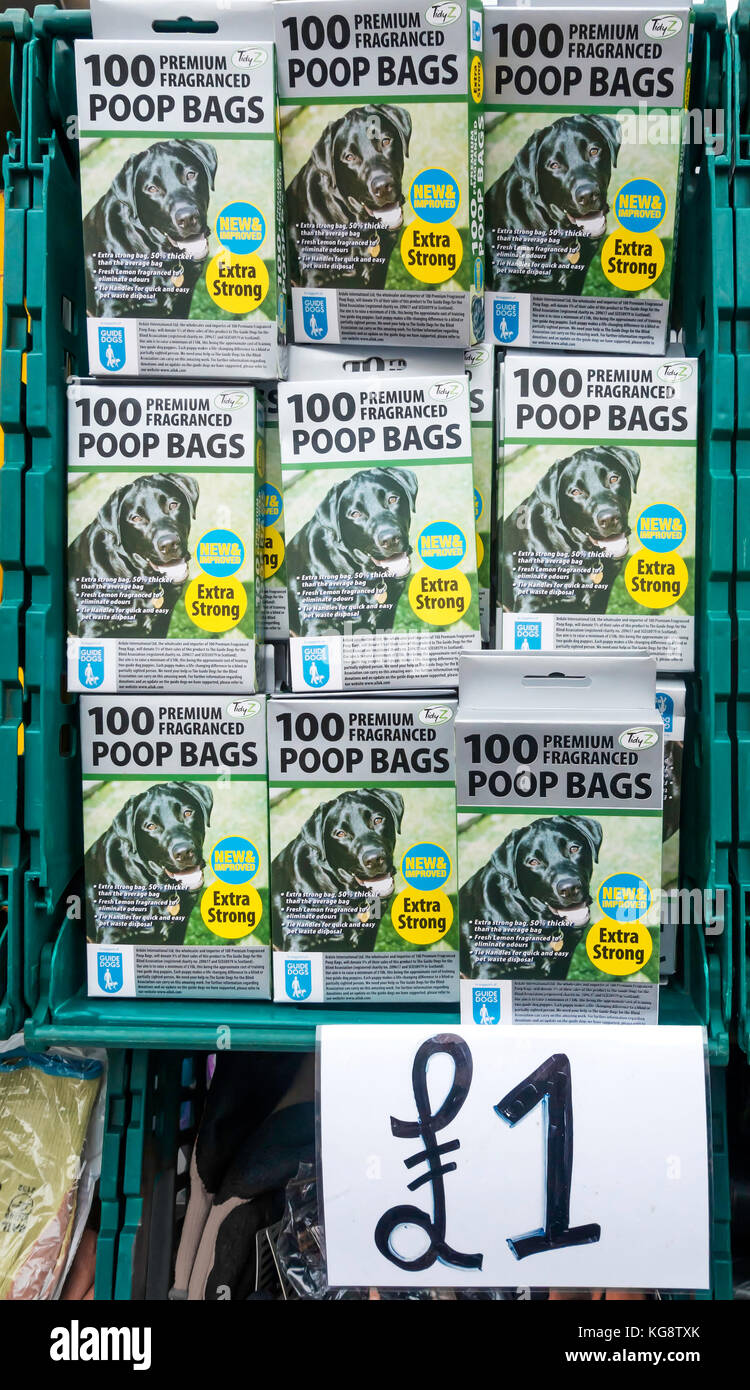 A market stall display of packs of premium fragranced poop bags for ...