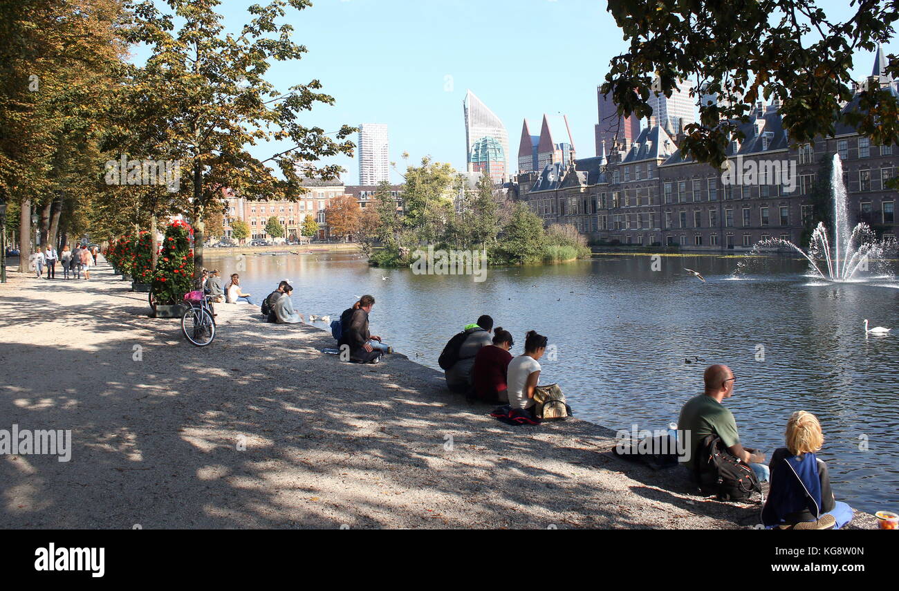 Young people and tourist enjoying summer at Hofvijver Pond, The Hague ...