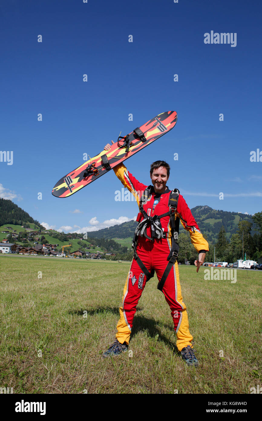 Skysurfer is flying high in the sky and having fun surfing his sky ...