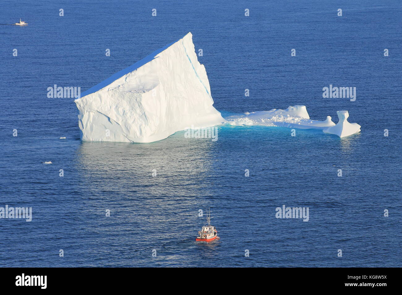 Ship approaching an iceberg in the Atlantic Ocean, just outside the ...