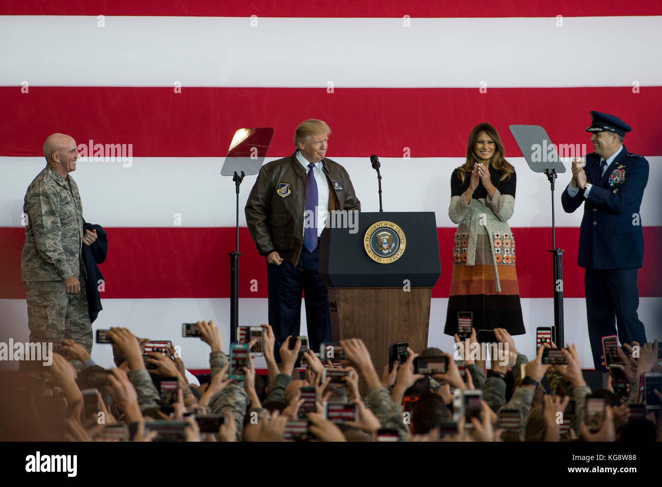 President Donald J. Trump puts on a flight jacket during a Troop Talk ...