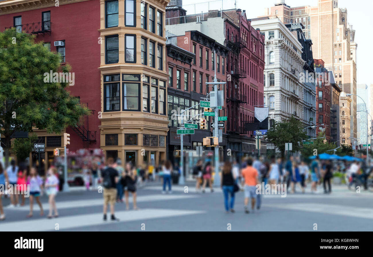 Crowd of anonymous people walking through Union Square Park in ...