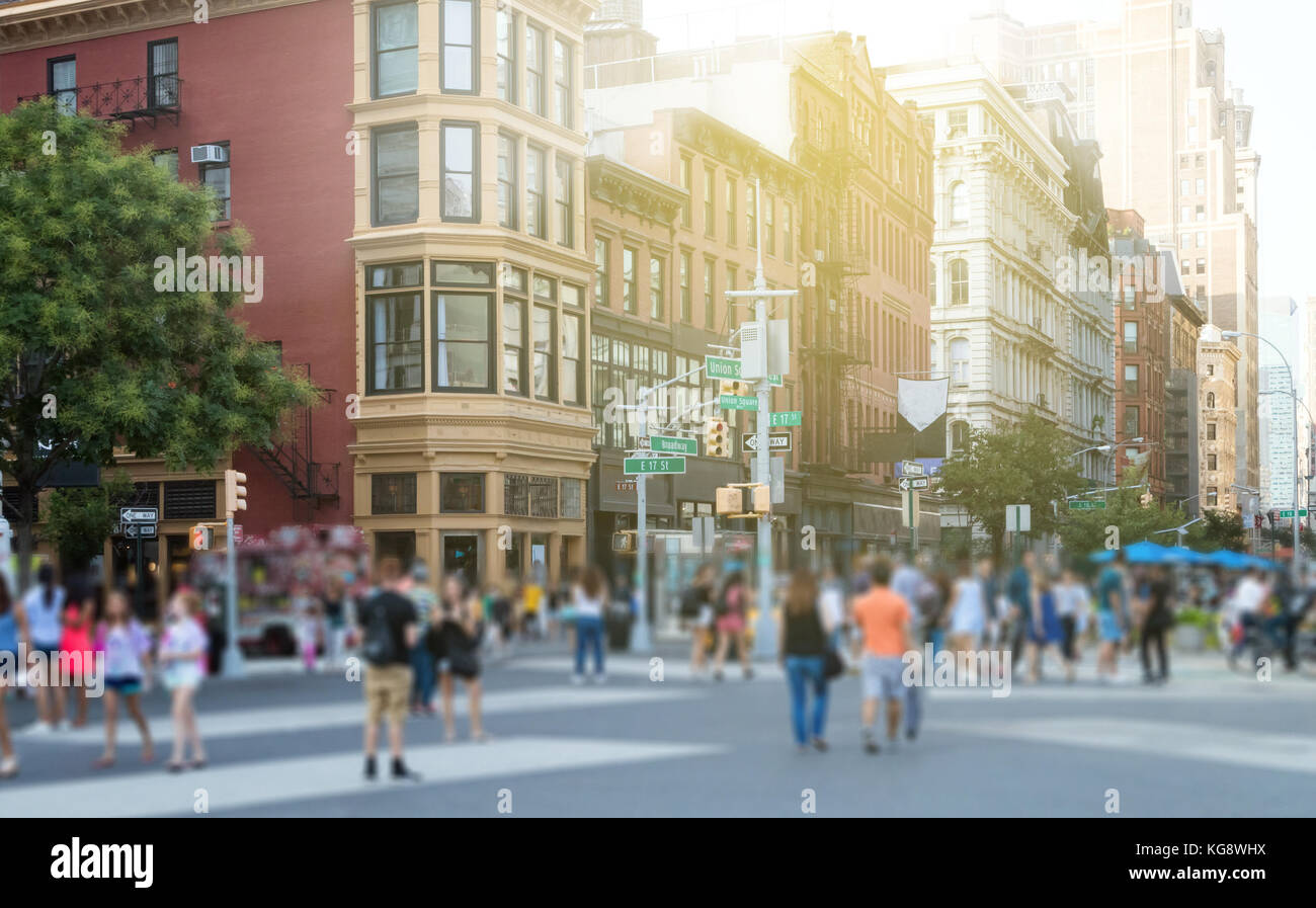 Crowd of anonymous people walking through Union Square Park in ...