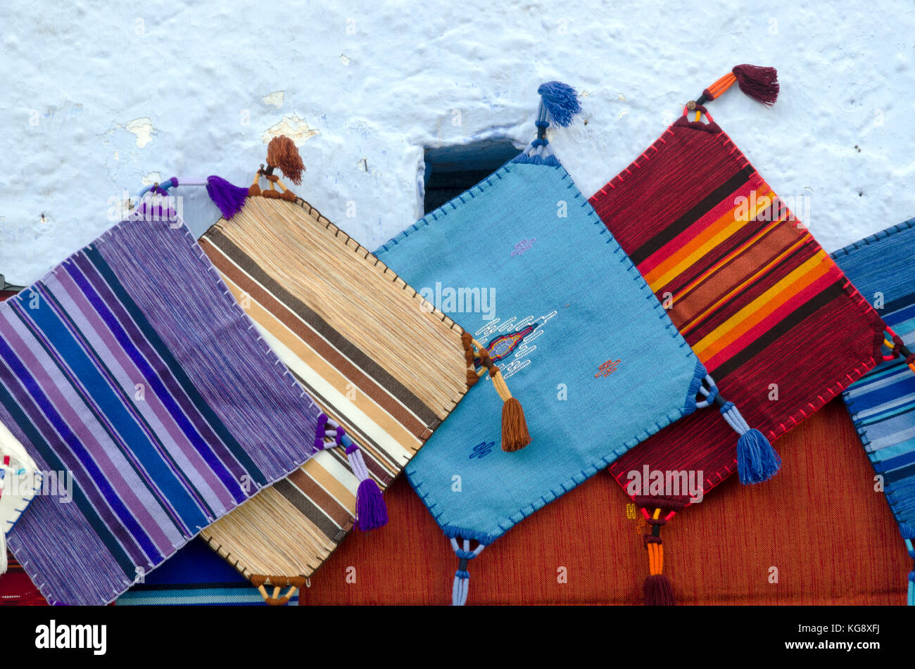 Colorful rugs displayed on walls in Chefchaouen, Morocco Stock Photo ...