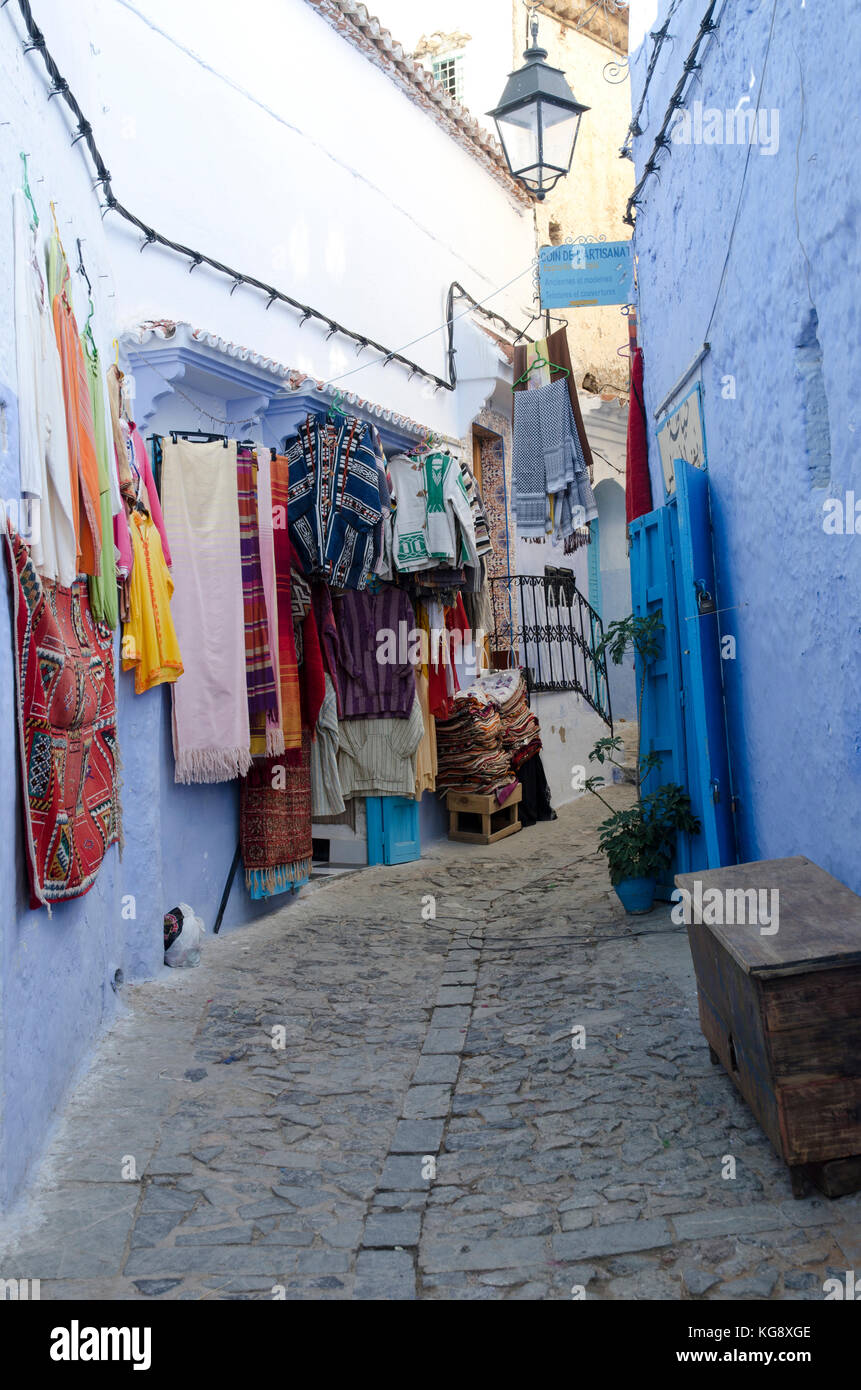 Displayed carpets and rugs in Chefchaouen's medina, Morocco Stock Photo ...