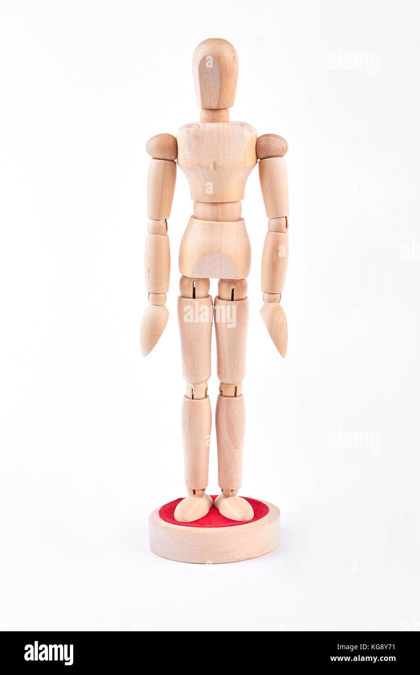 Wooden figure stand isolated on white background Stock Photo - Alamy