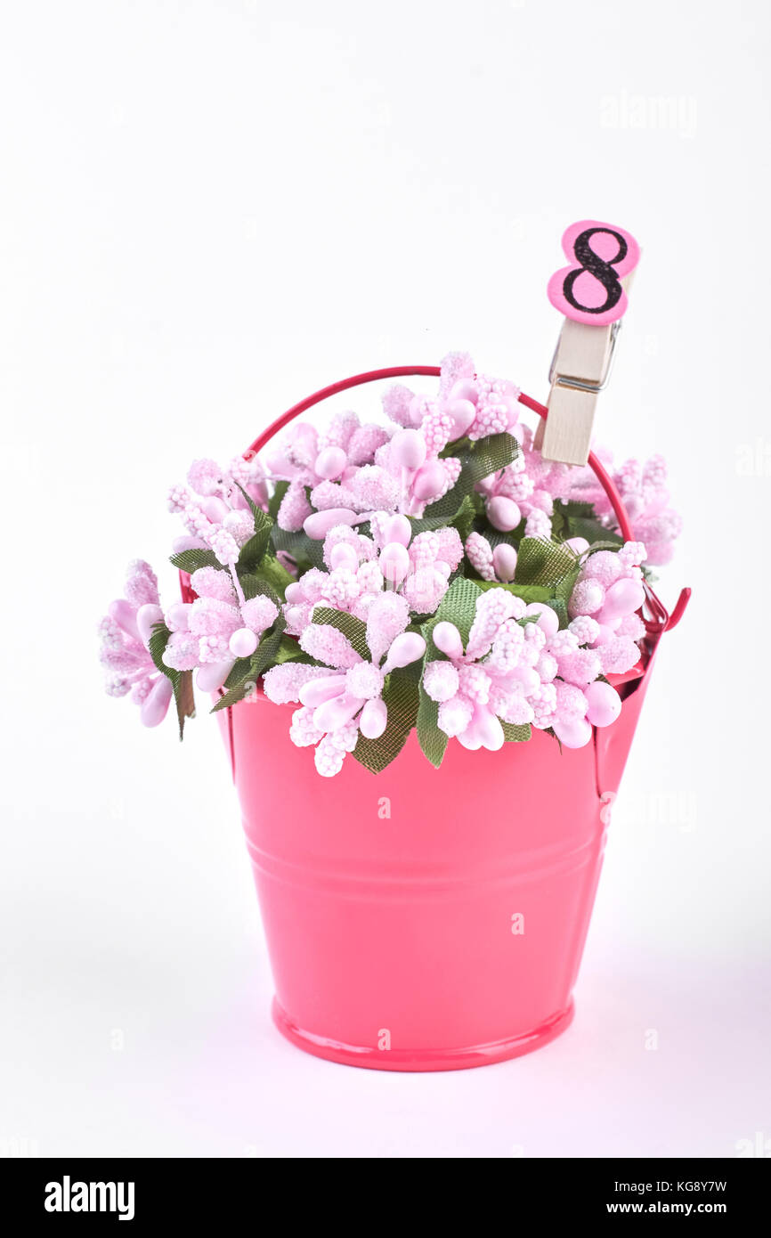 Bucket with flowers and number eight Stock Photo - Alamy