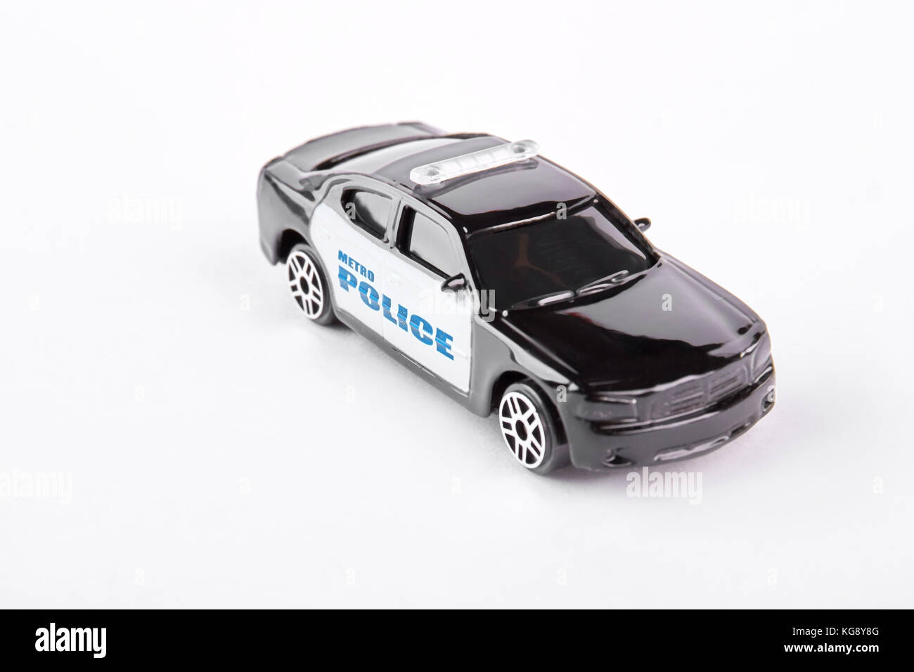 Metro police car toy, white background Stock Photo - Alamy