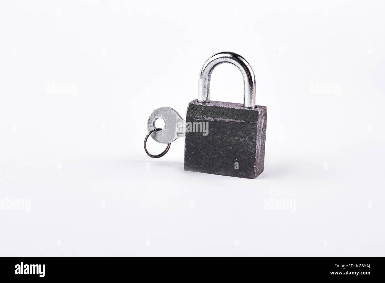 Old padlock with silver key Stock Photo - Alamy