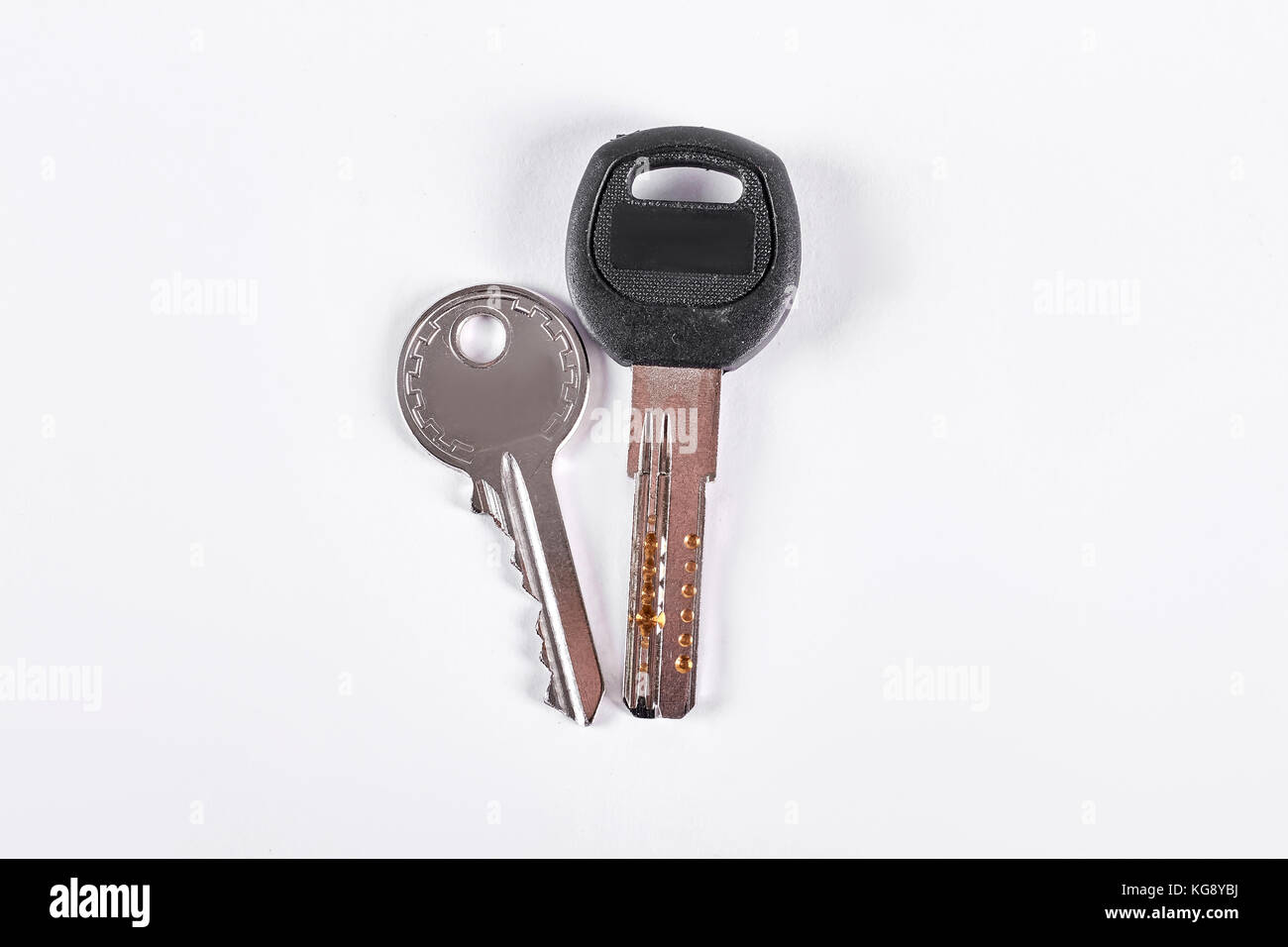 Two keys on white background Stock Photo - Alamy