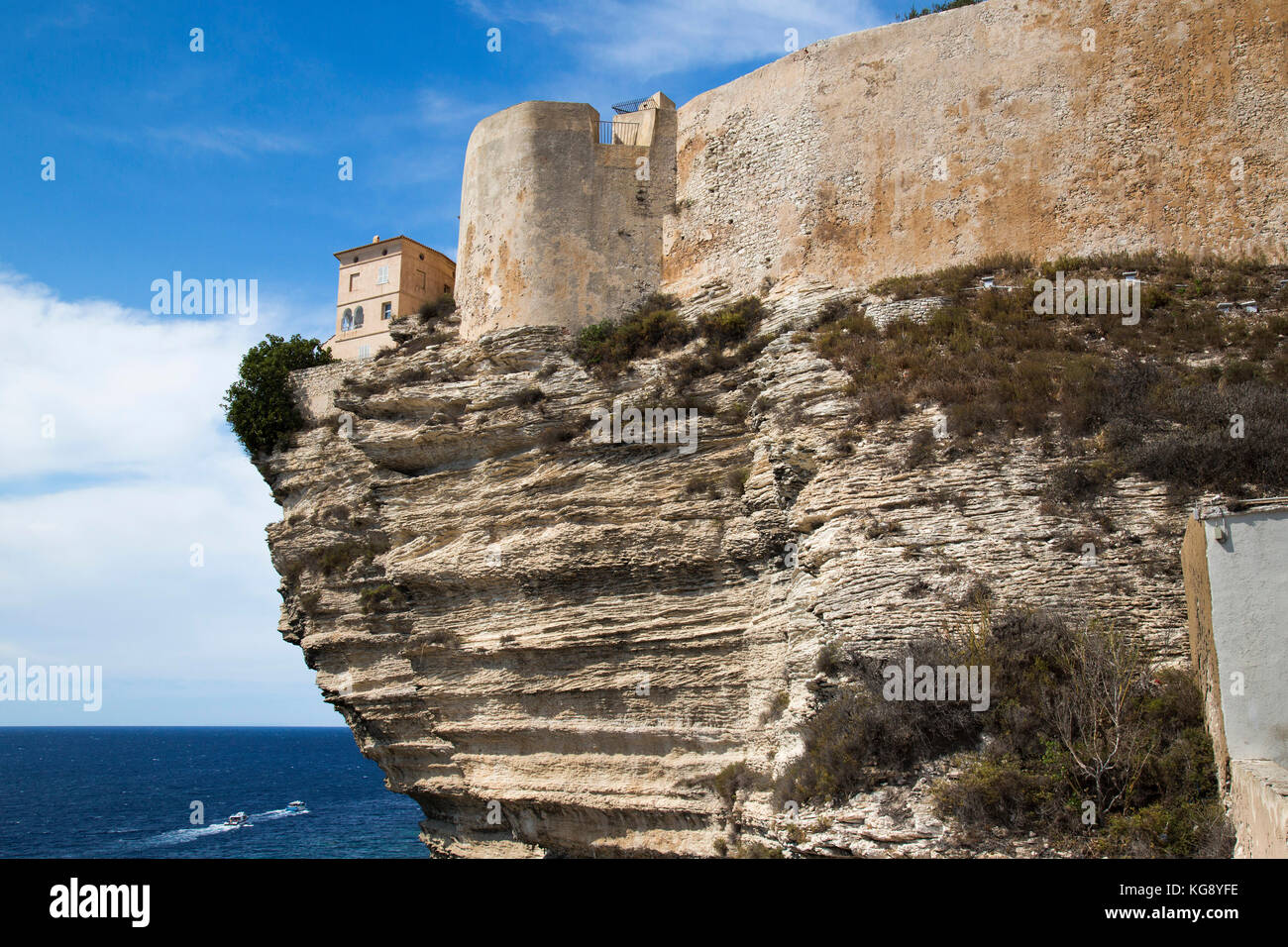 Citadel of Bonifacio, with high walls of the fort on the clifftop ...