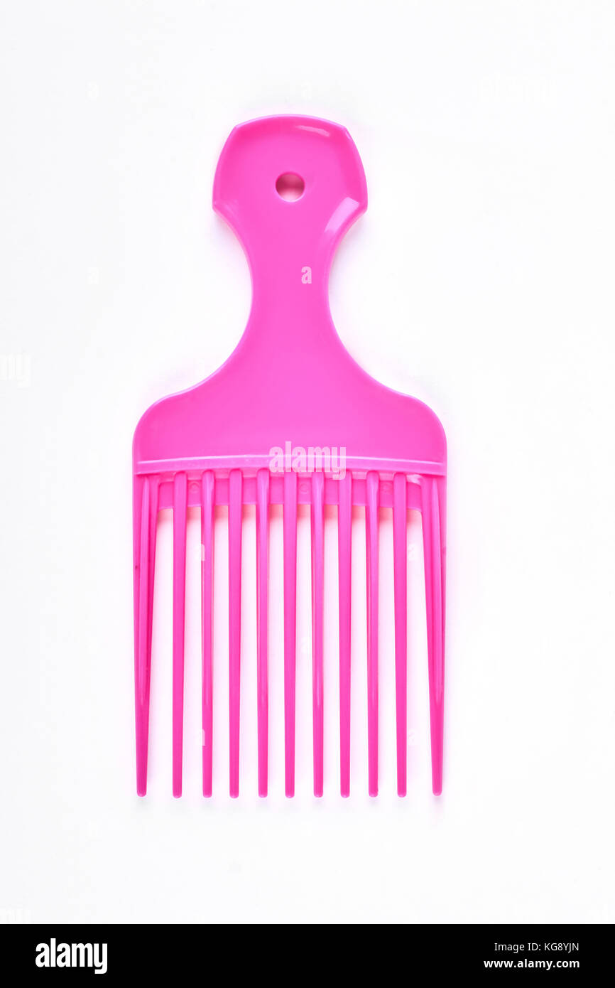 Pink comb styling hair Cut Out Stock Images & Pictures - Alamy