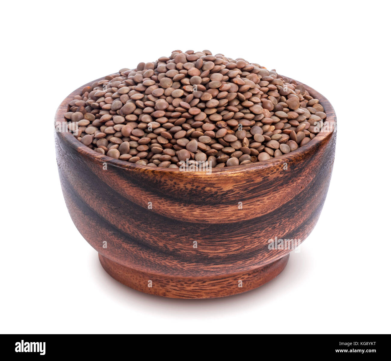 Lentils in wooden bowl isolated on white background Stock Photo - Alamy
