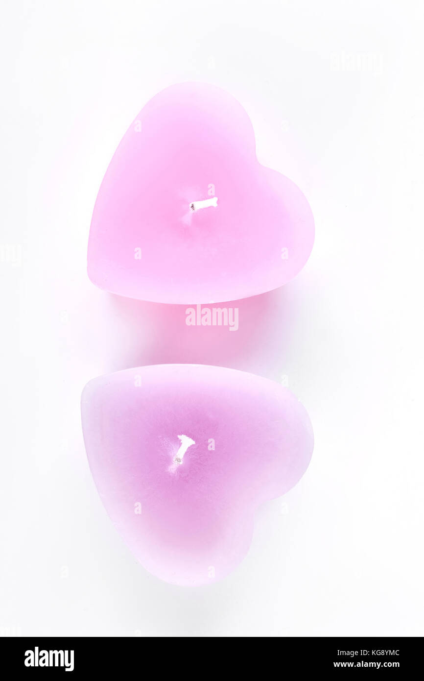 Two pink heart shape candles Stock Photo - Alamy
