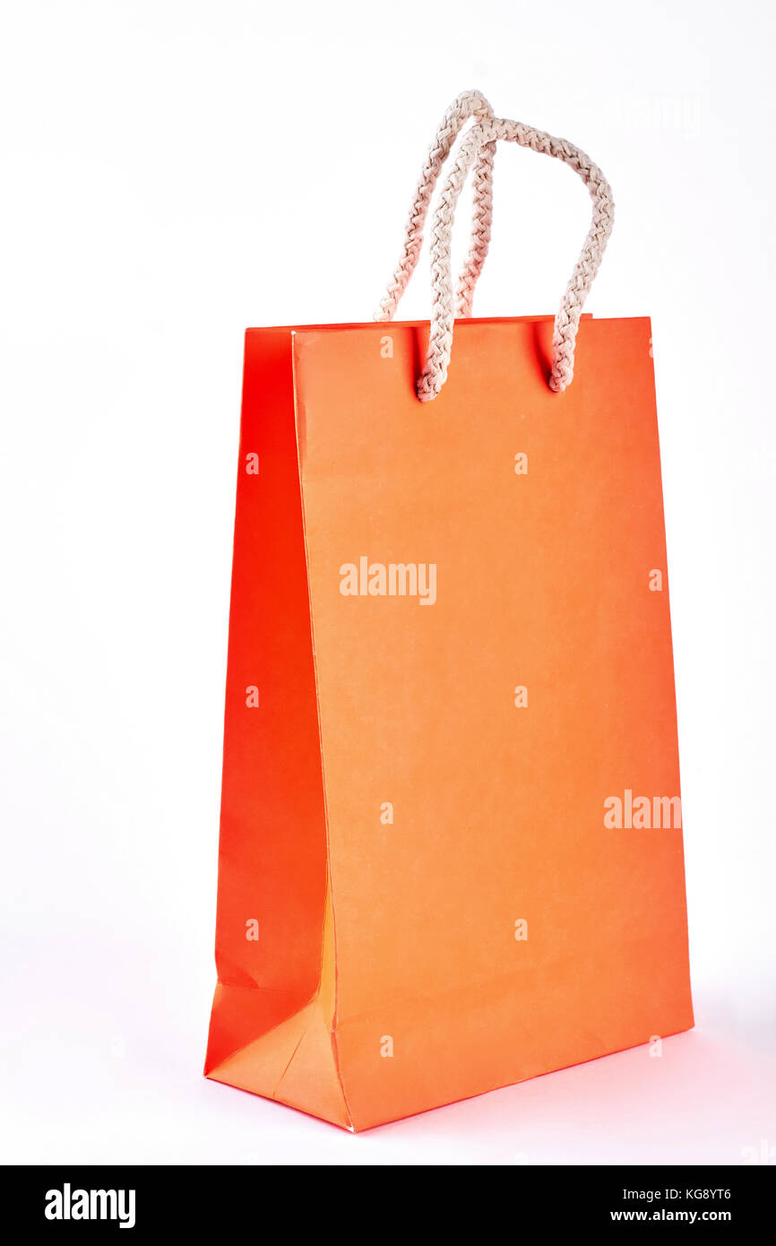 Paper shopping packet on white background Stock Photo - Alamy