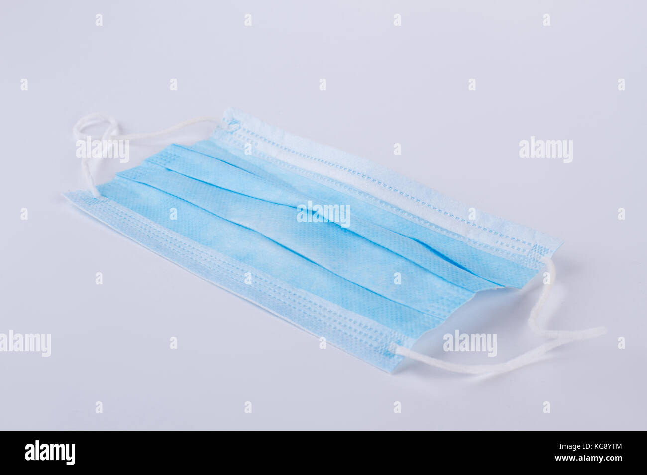 Medical face mask, grey background Stock Photo - Alamy
