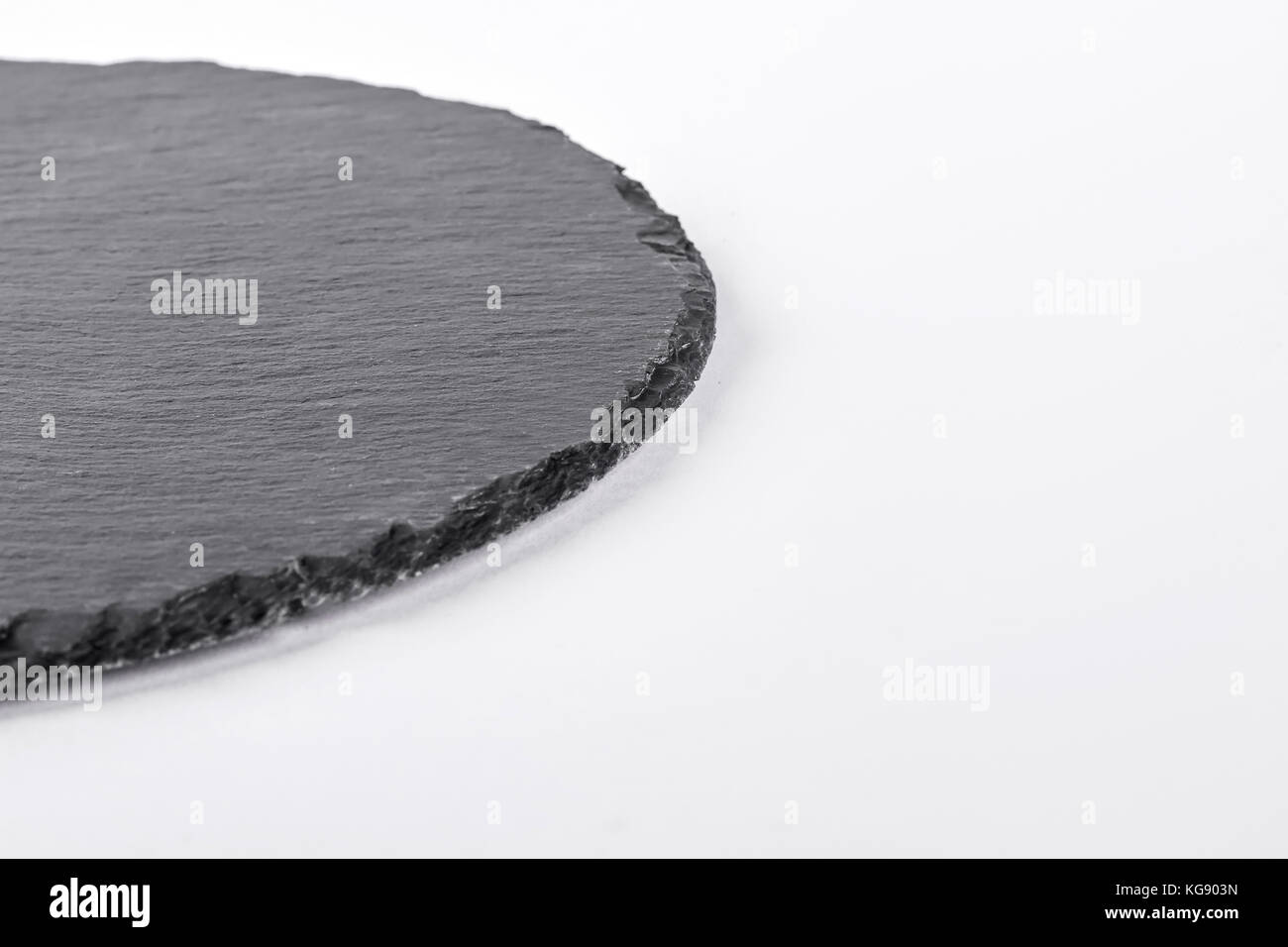 Round natural slate cheese board Stock Photo - Alamy