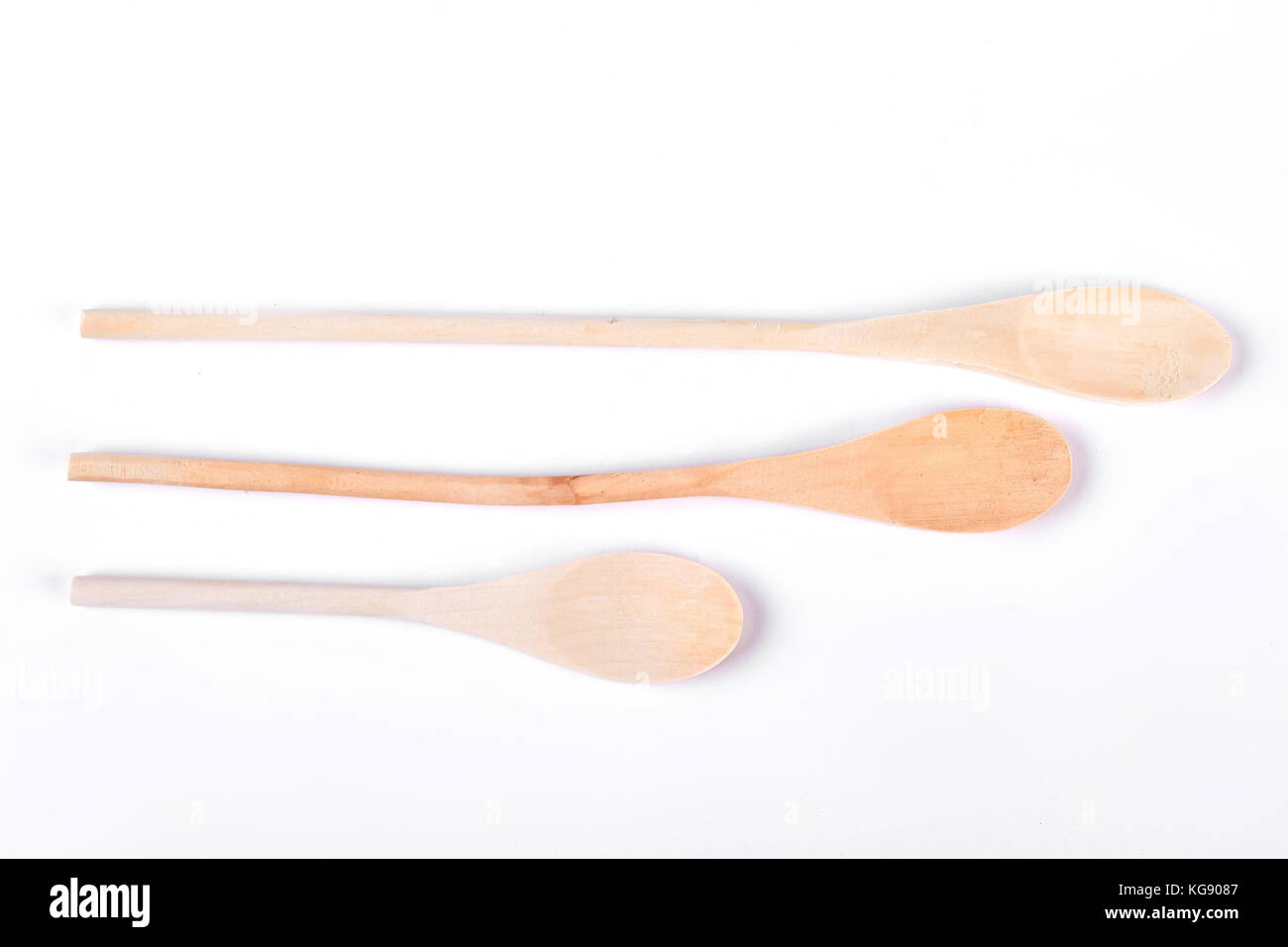 Set of wooden spoons, white background Stock Photo - Alamy