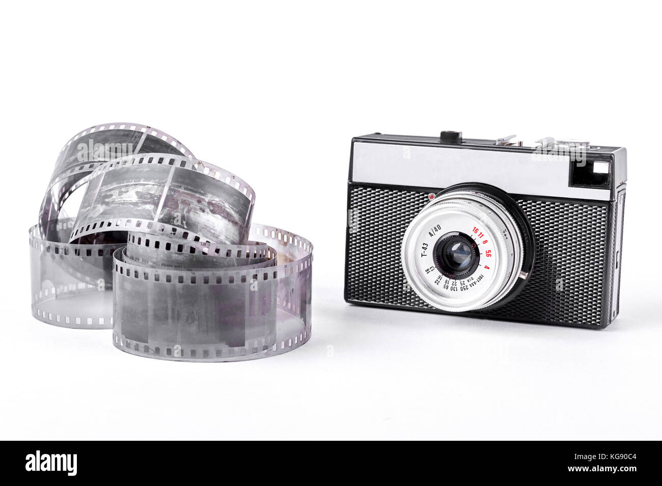 Old camera and tape on white background Stock Photo - Alamy