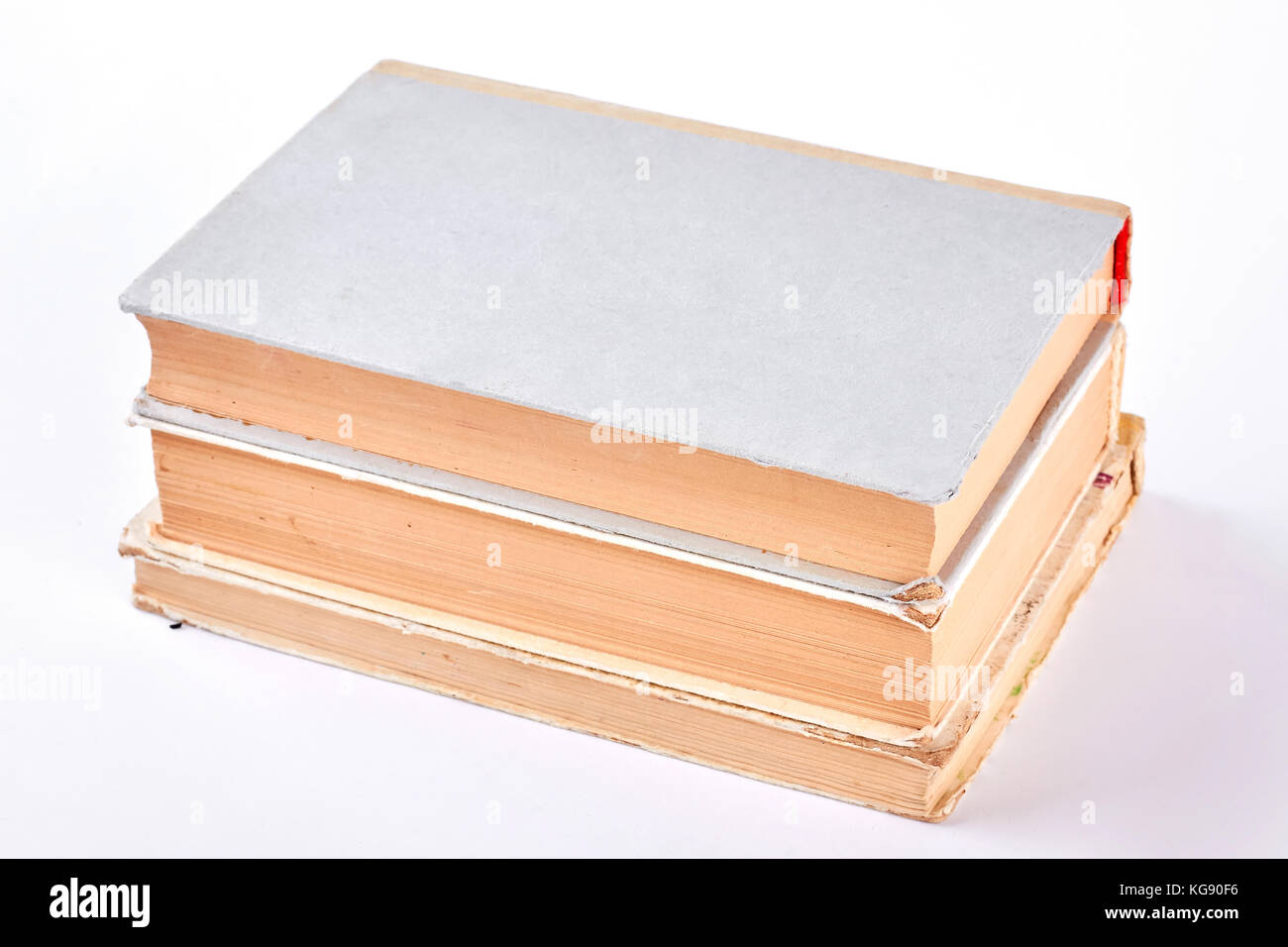 Three old books, white background Stock Photo - Alamy
