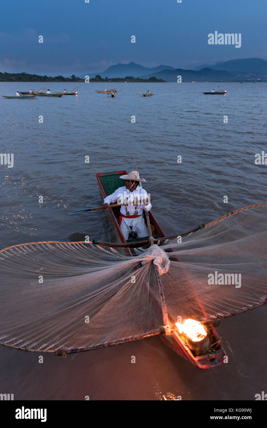 Indigenous Purépecha butterfly fisherman on Lake Patzcuaro at twilight ...