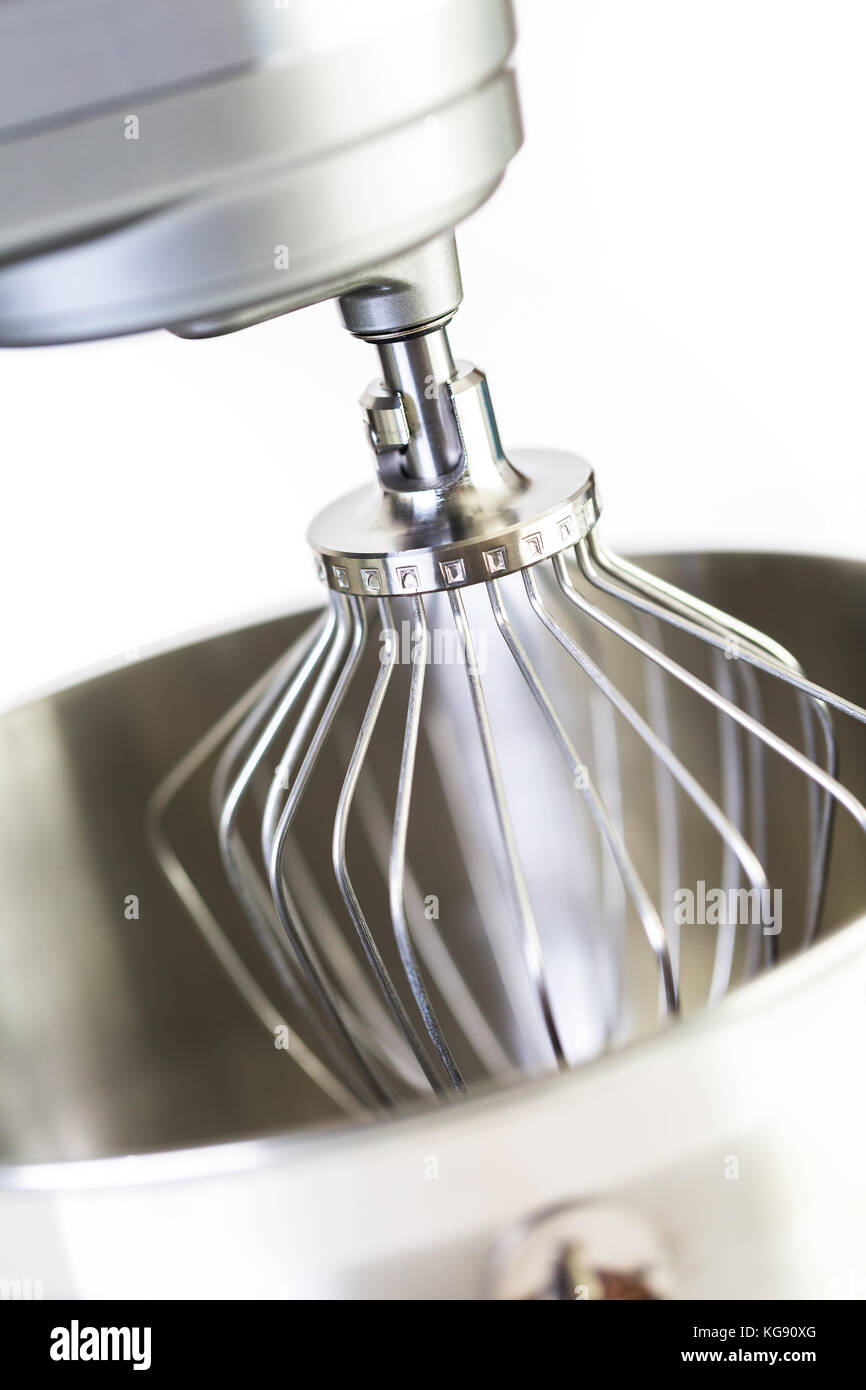 Silver food electric mixer on a white background Stock Photo - Alamy