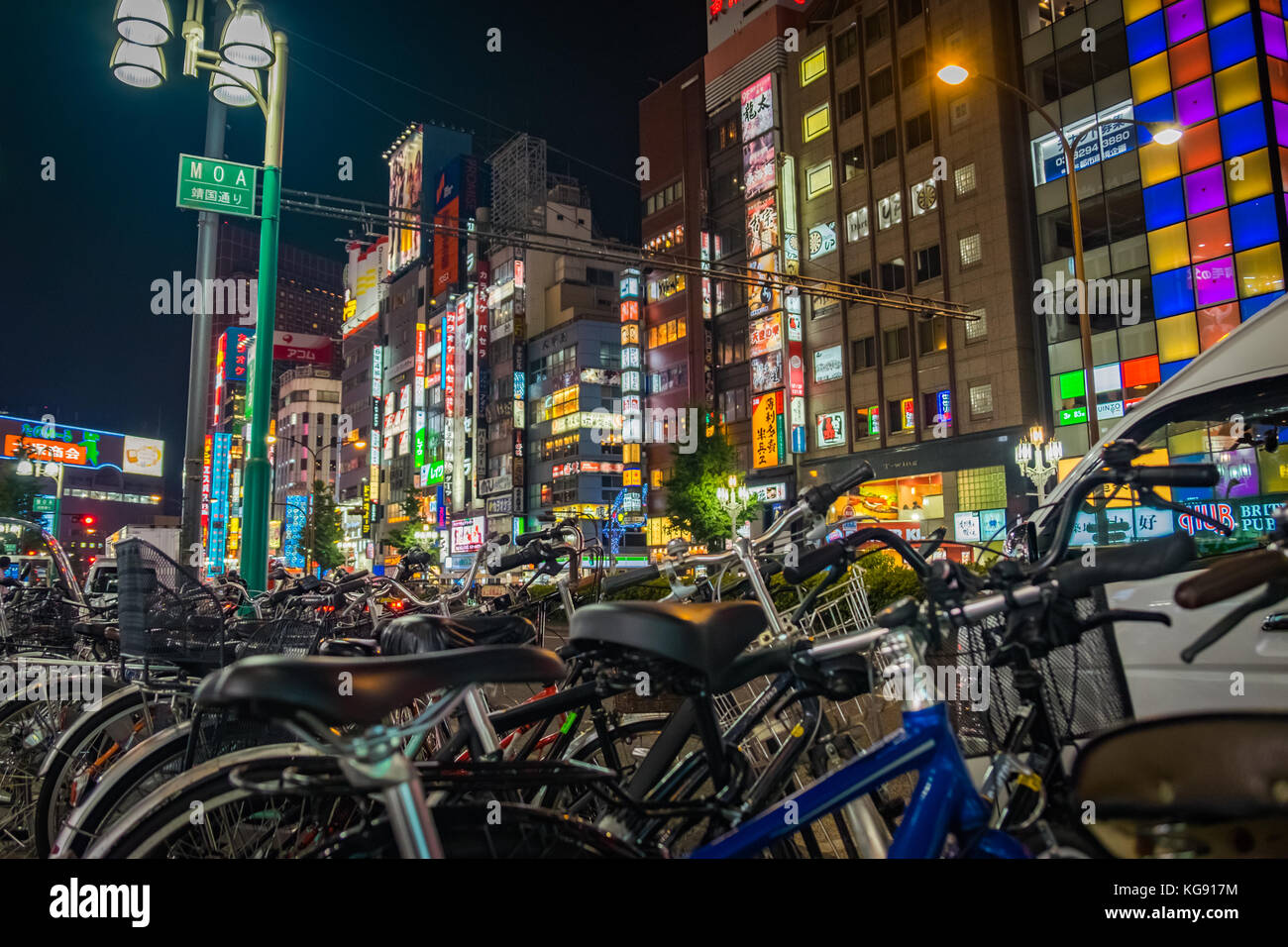 Bicycles on a street at night in Tokyo - May 2017 Stock Photo - Alamy