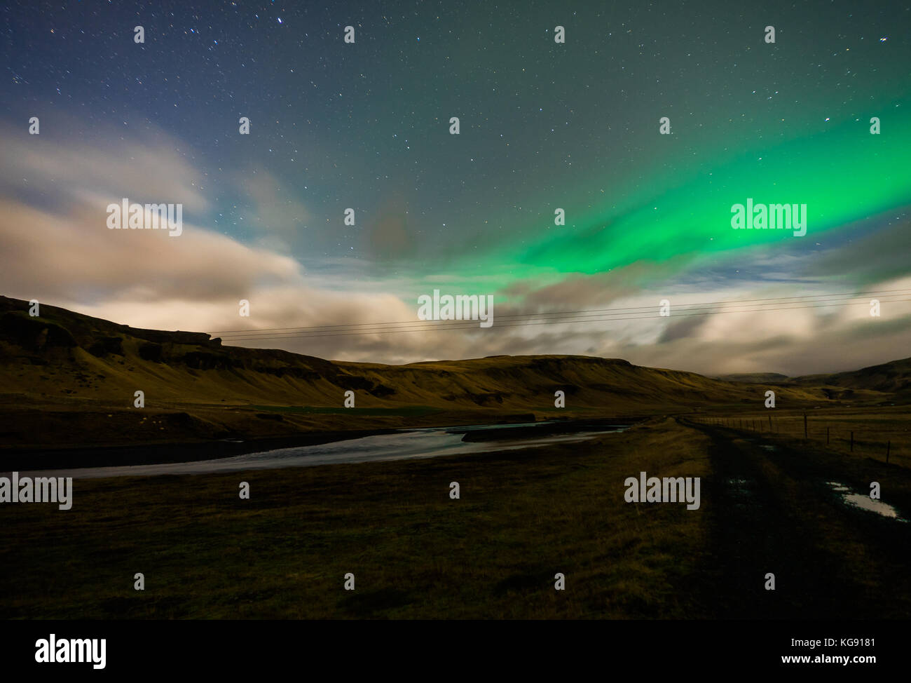 Northern lights Aurora Borealis above landscape in Iceland Stock Photo ...